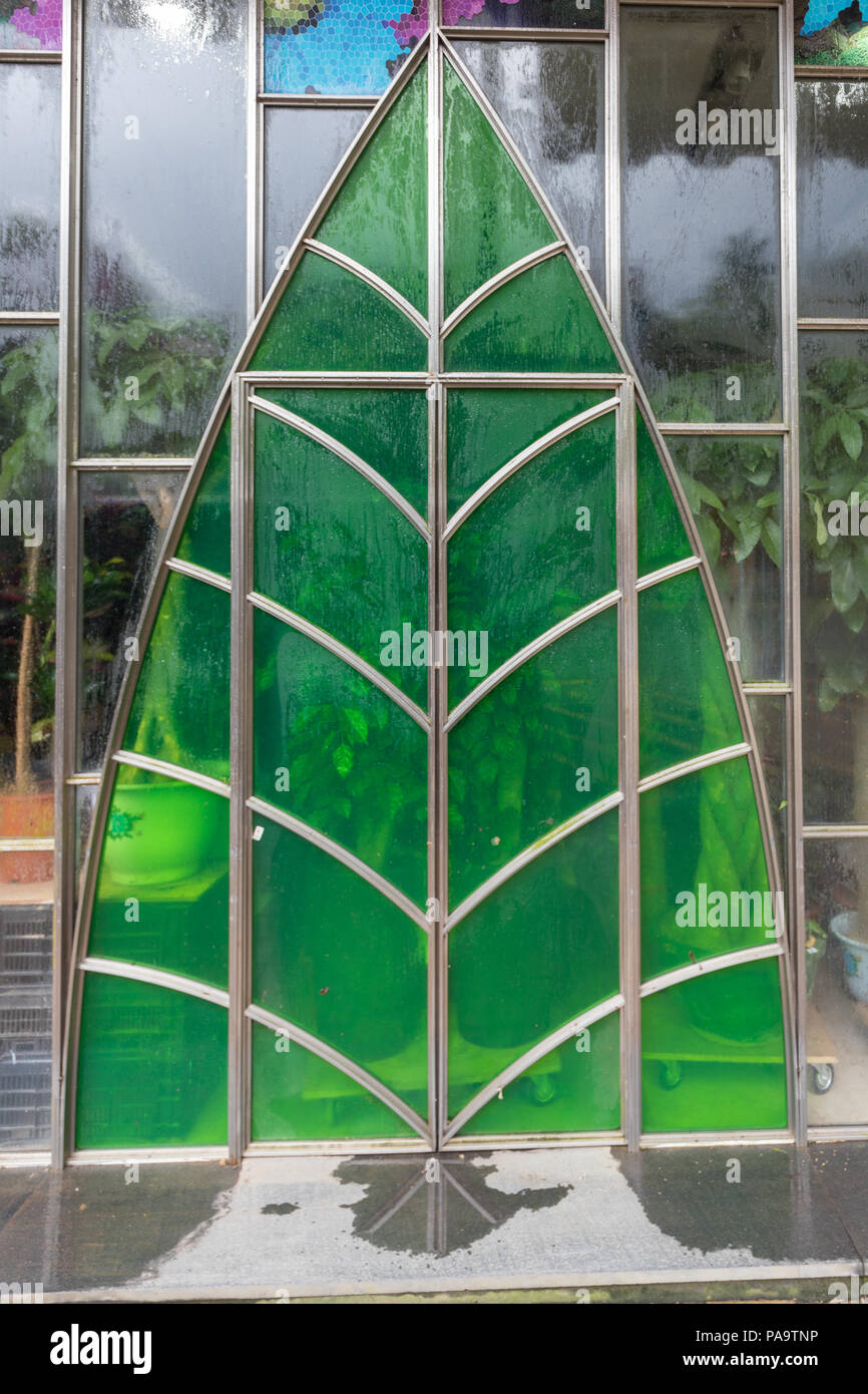 Green Glass Door at Greenhouse Plants Nursery Stock Photo - Alamy