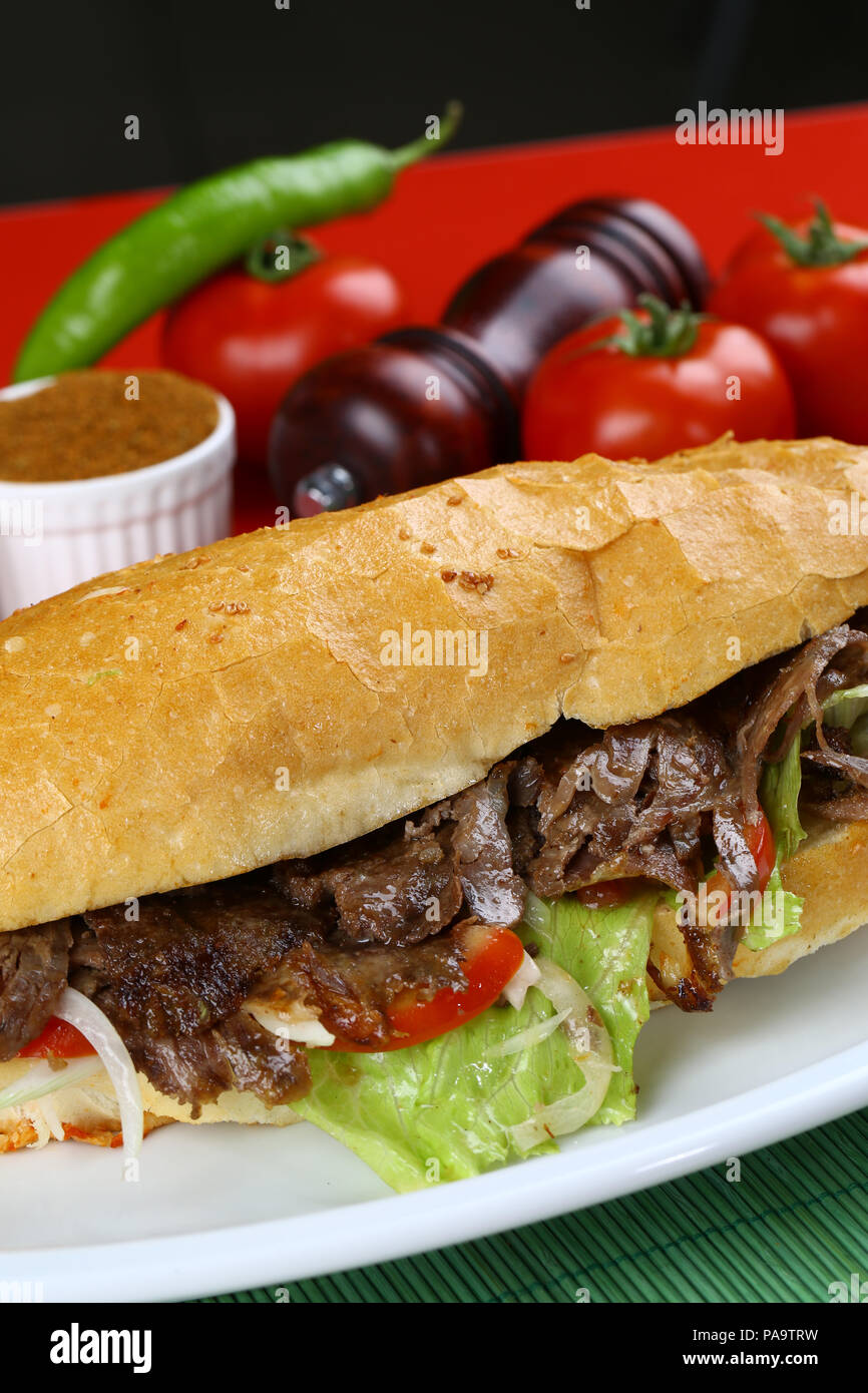 Traditional Turkish doner kebab shawarma in bread sandwich Stock Photo ...
