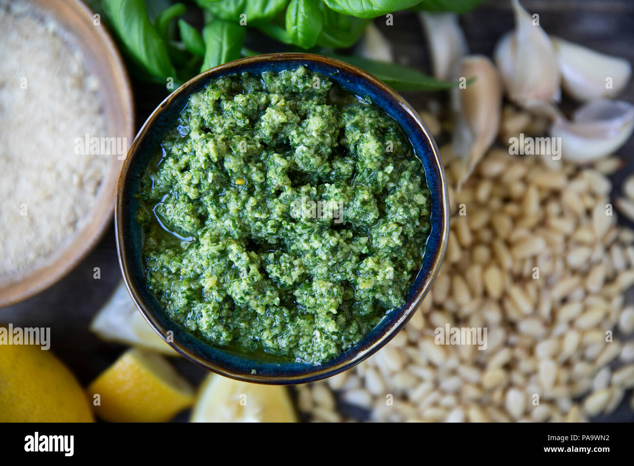 Bowl of homemade pesto and fresh ingredients viewed from above Stock ...