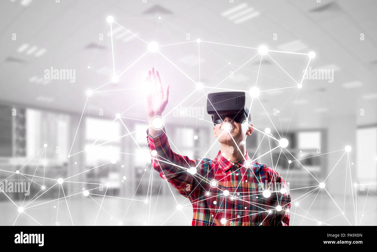 Guy wearing checked shirt and virtual mask reaching hand to touch ...