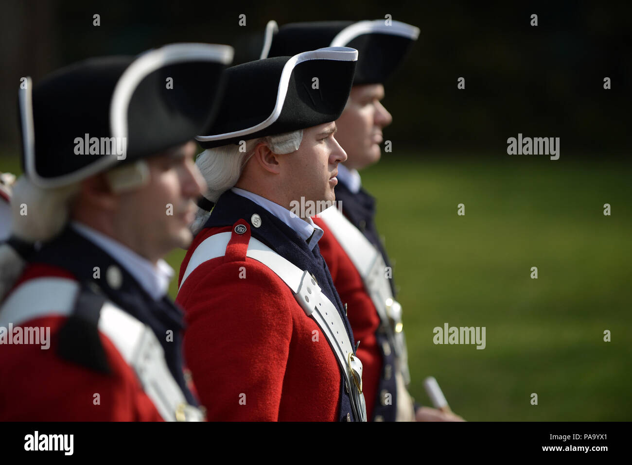 Members of the U.S. Army's "Old Guard" march past visitors at the White ...