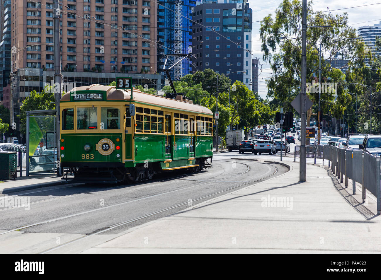 Old-fashioned tram in Melbourne amid heavy traffic Stock Photo - Alamy