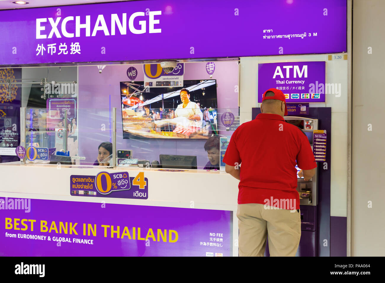 BANGKOK, THAILAND - 21 JULY 2018 - A man gets money from ATM machine at ...