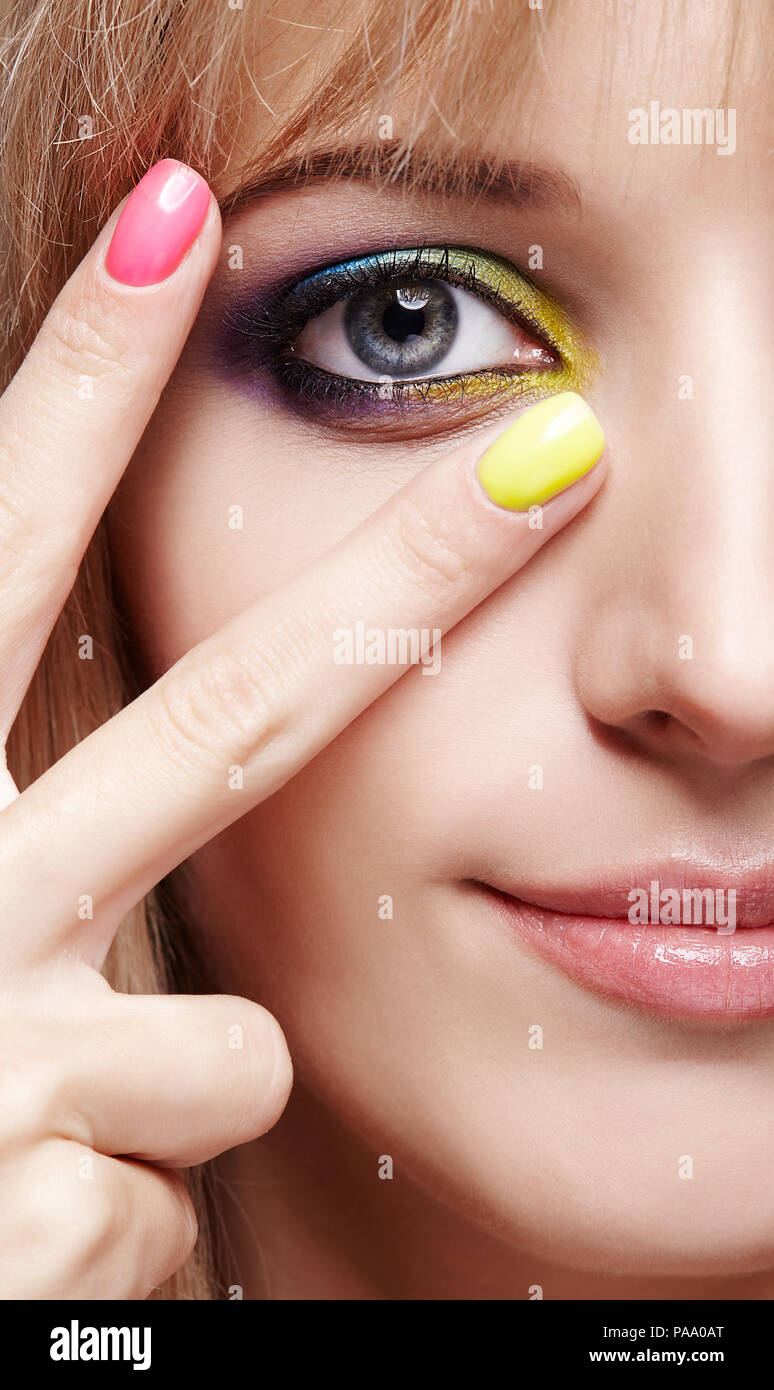 Closeup macro image of human female eye with violet shadows, blue and ...