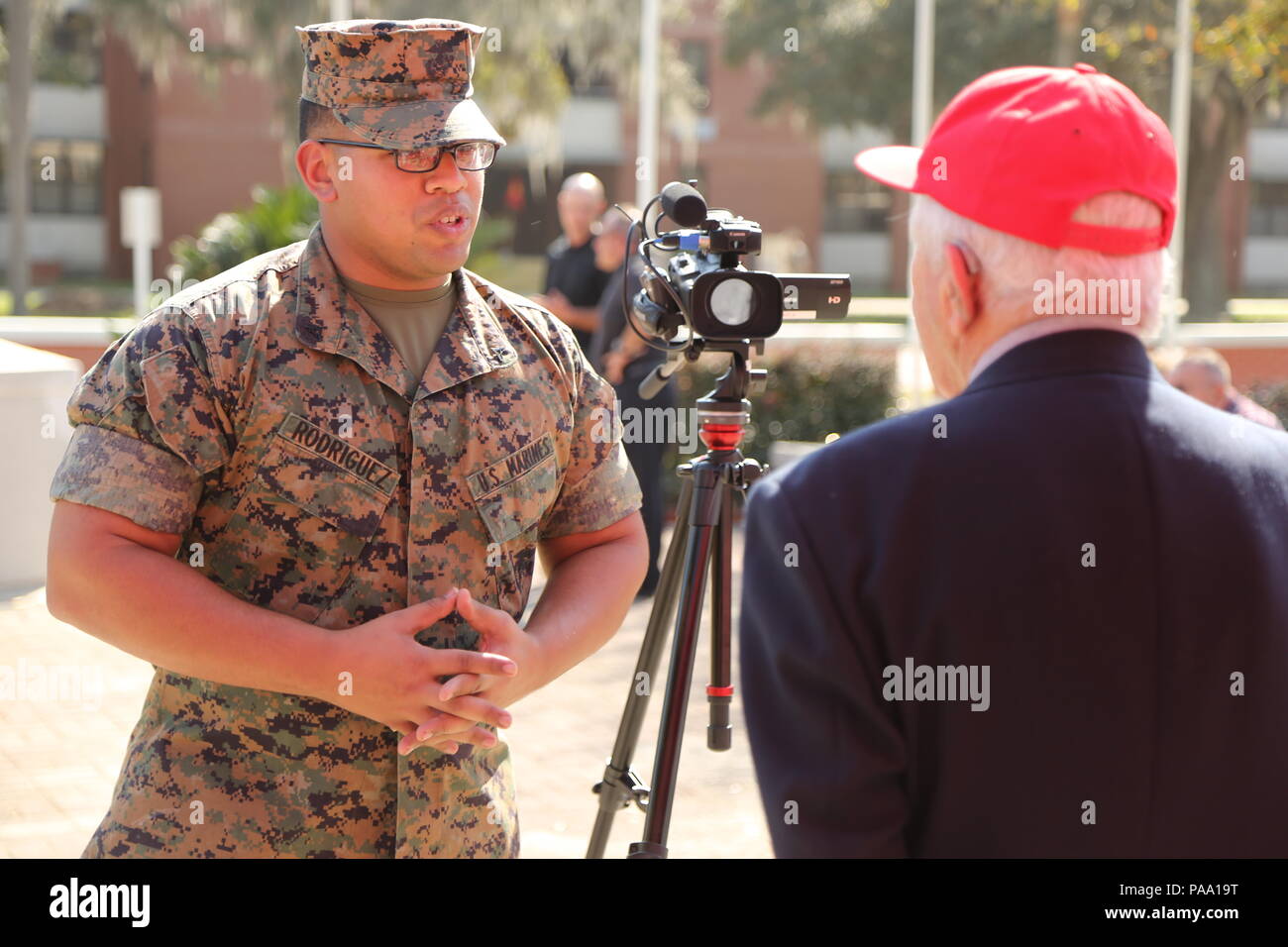 U.S. Marine Corps Lance Cpl. Raphael Rodriguez, a combat videographer ...