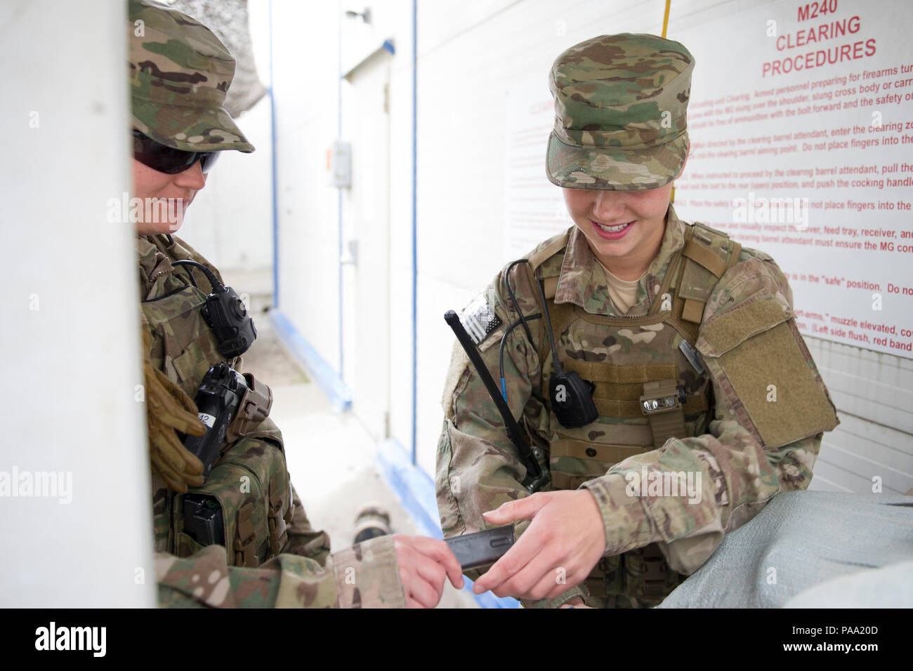 Two 455th ESFS FAST members supervise weapon preparation at a clearing ...