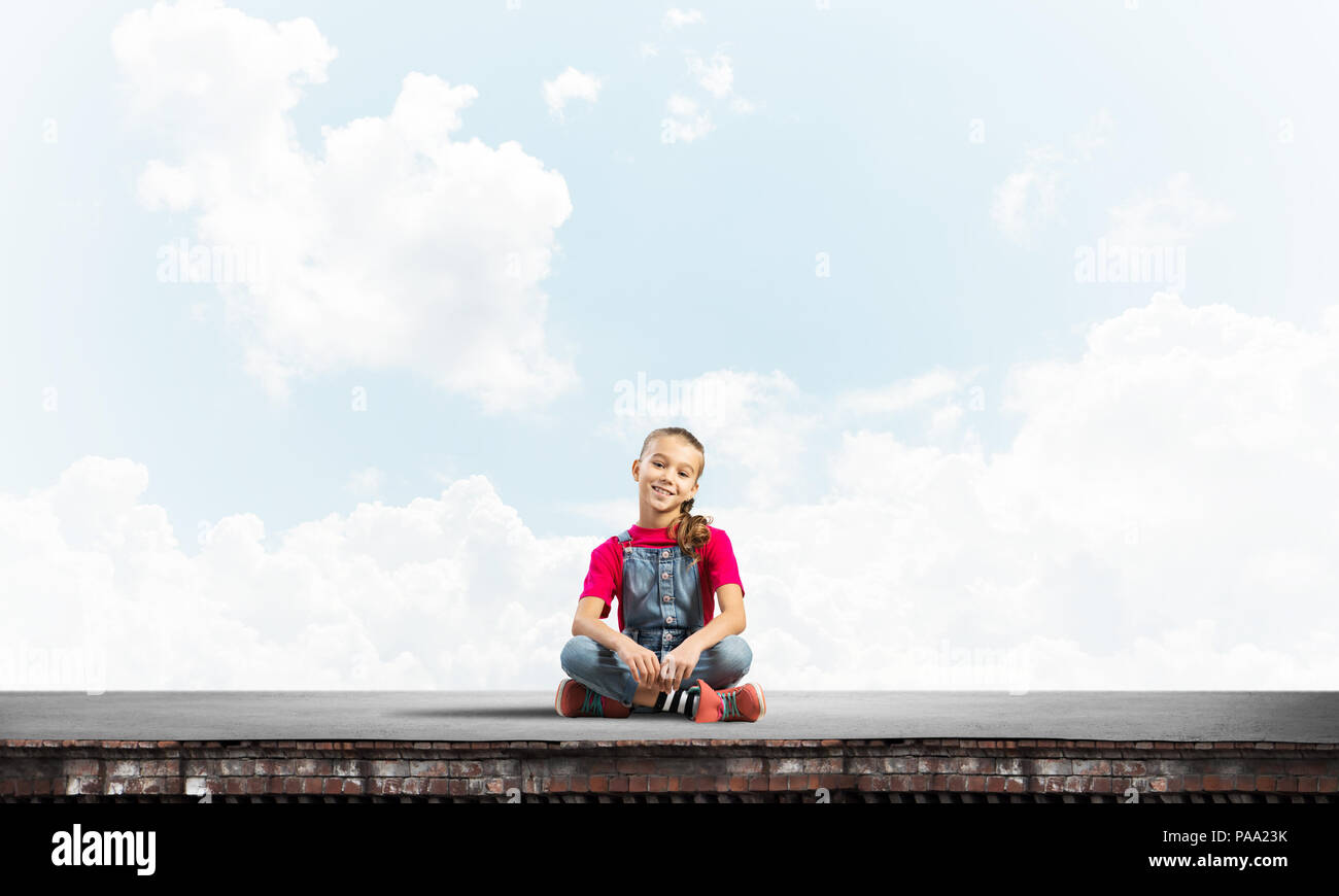 Concept of careless happy childhood with girl of school age smilling ...