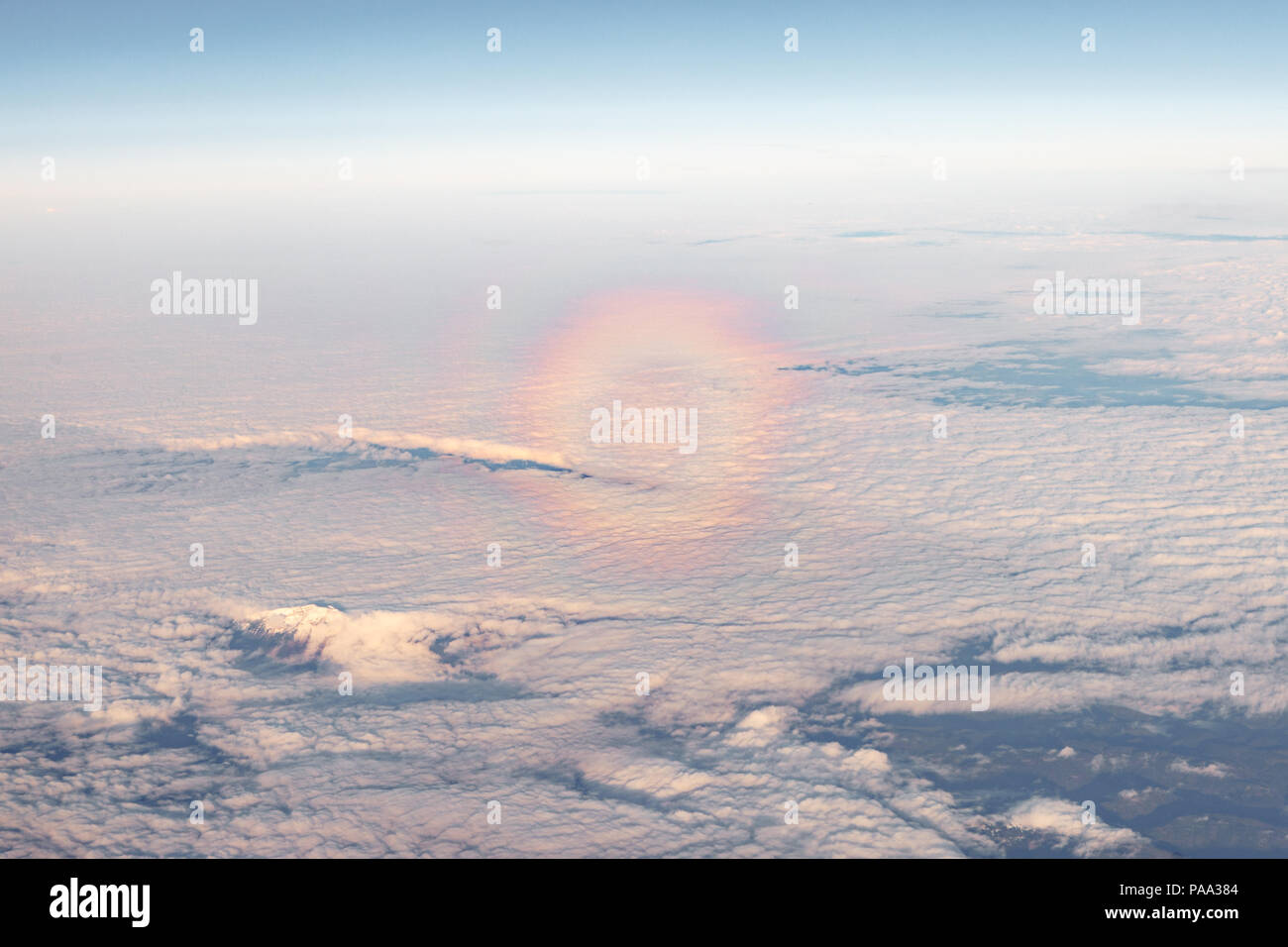 The circle rainbow through the window of the plane Stock Photo - Alamy