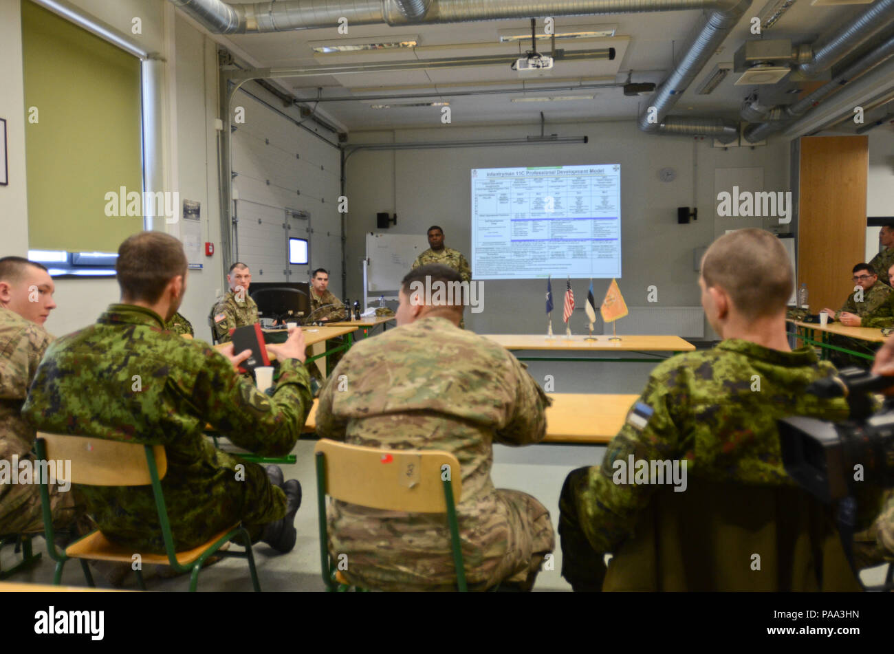 An Estonian noncommissioned officer (NCO) asks Sgt. 1st Class Jesse ...