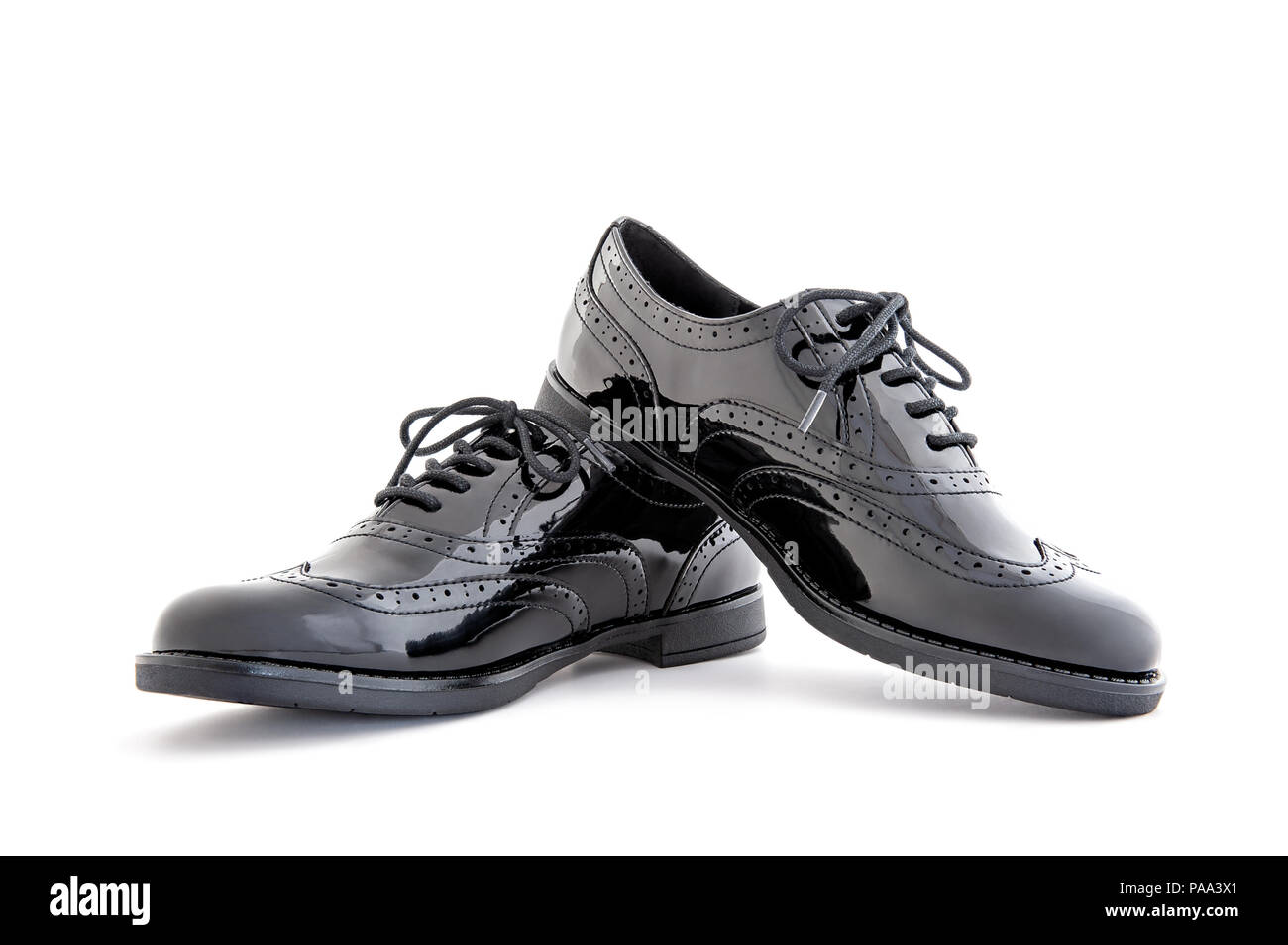 Close up of beautiful girl's elegant black leather shoes photographed ...