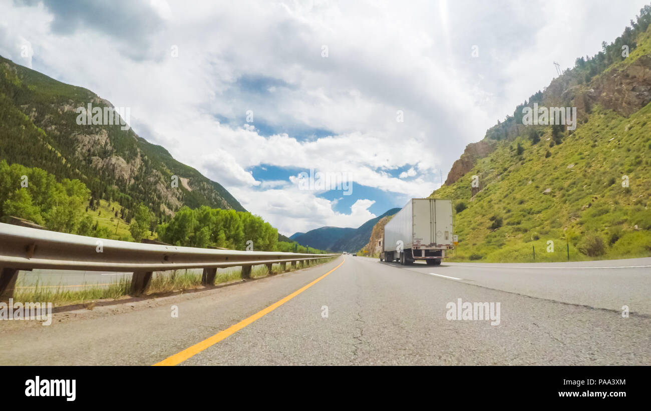 Semi truck driving through the mountains hi-res stock photography and ...