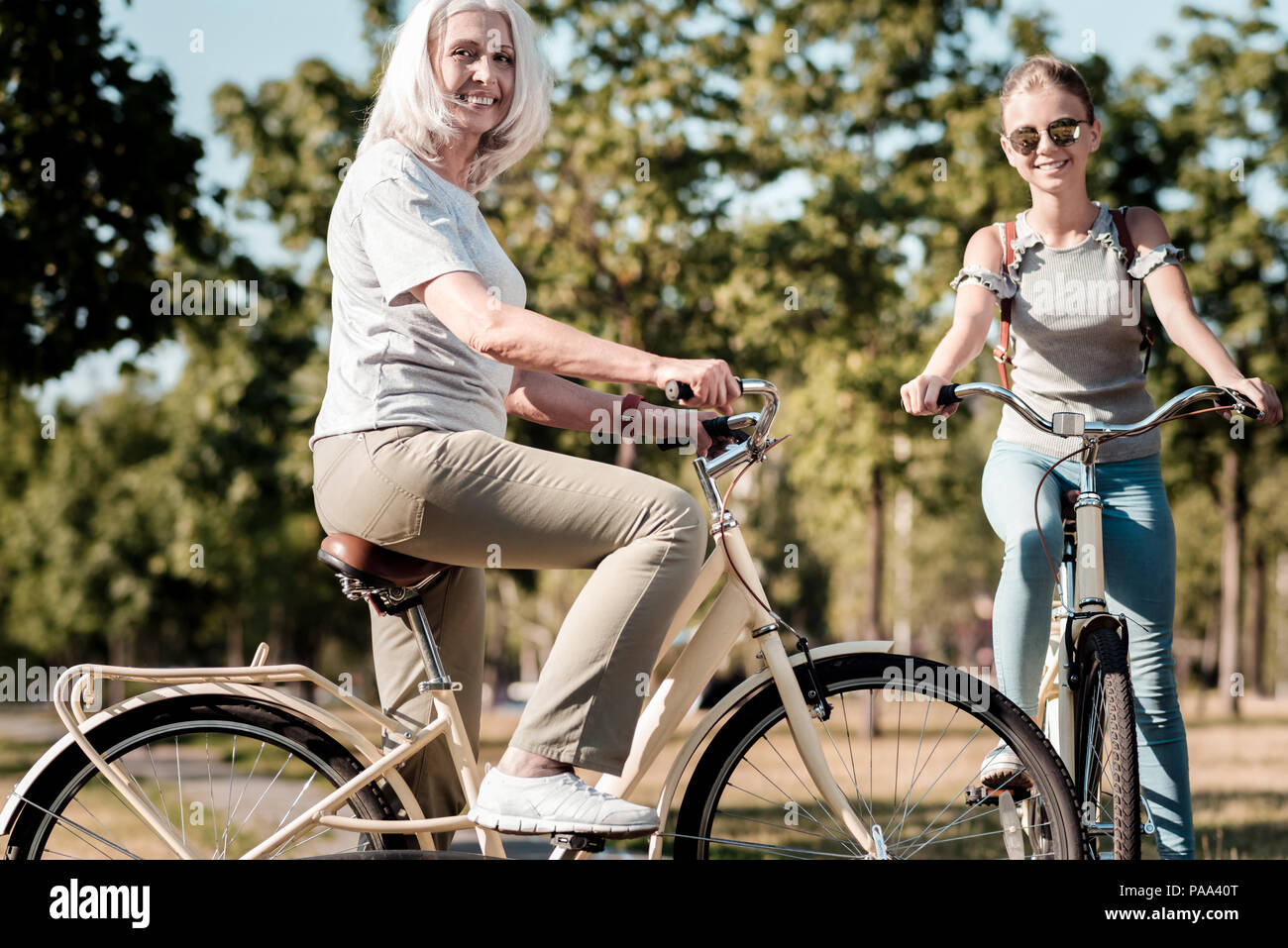 Woman riding bicycle, profile hi-res stock photography and images - Alamy