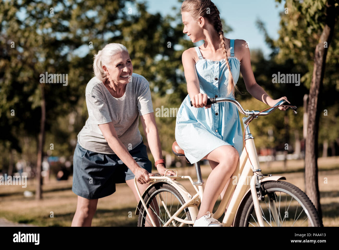Active female person spending time with her kid Stock Photo - Alamy