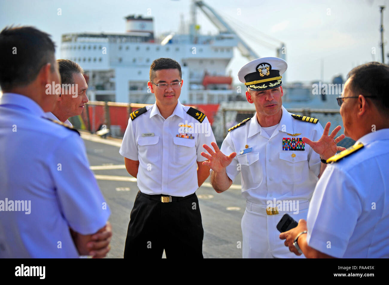 160319-N-TV402-047 SINGAPORE (March 19, 2016) Commanding officer of the ...