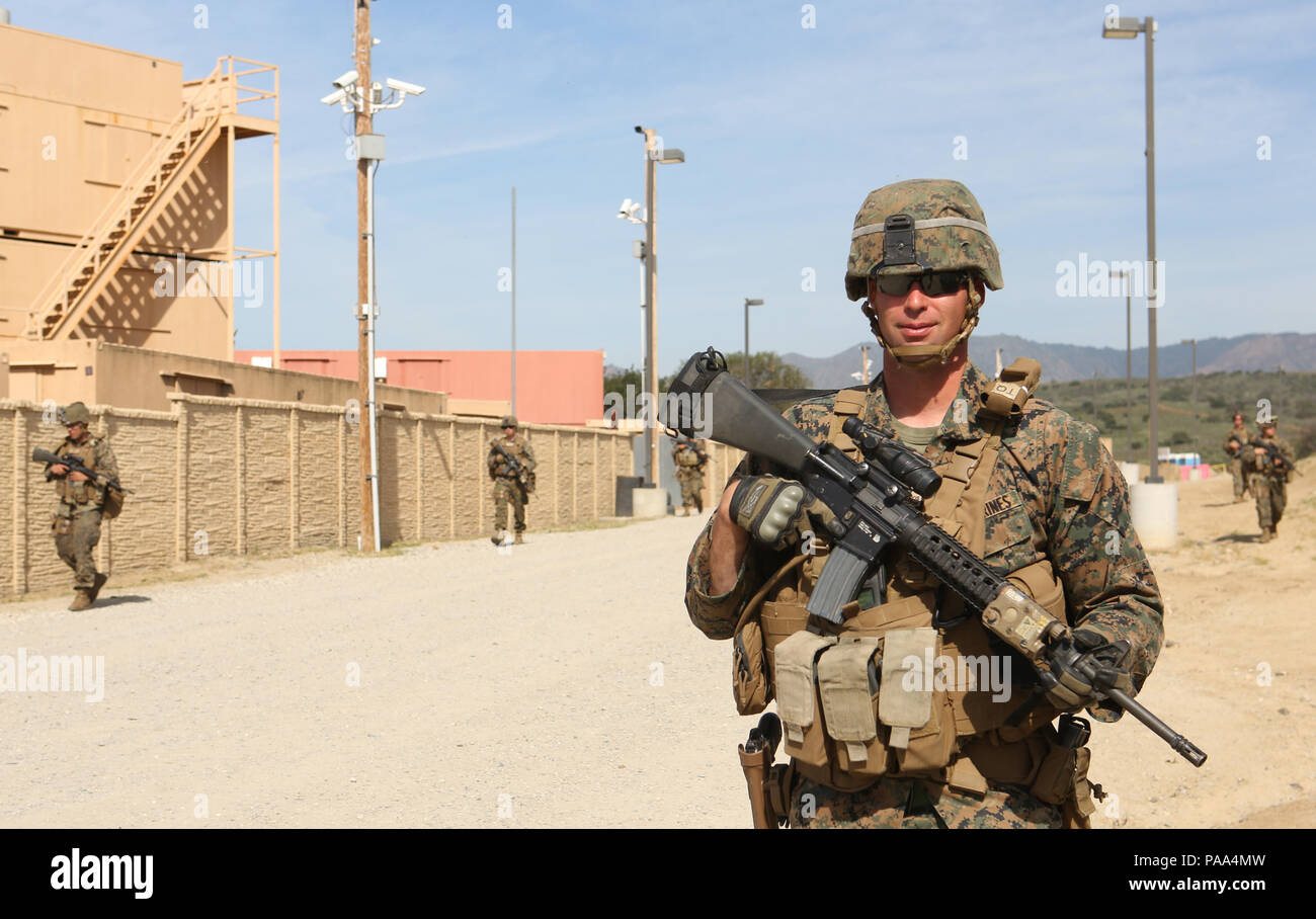Cpl. Russ J. Bhyre walks in a tactical column with his squad during a ...