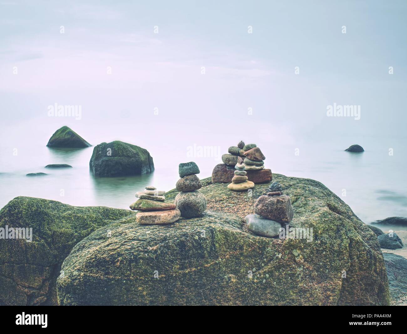 Stones pyramid symbolizing zen harmony balance pebbles. Peaceful ocean ...