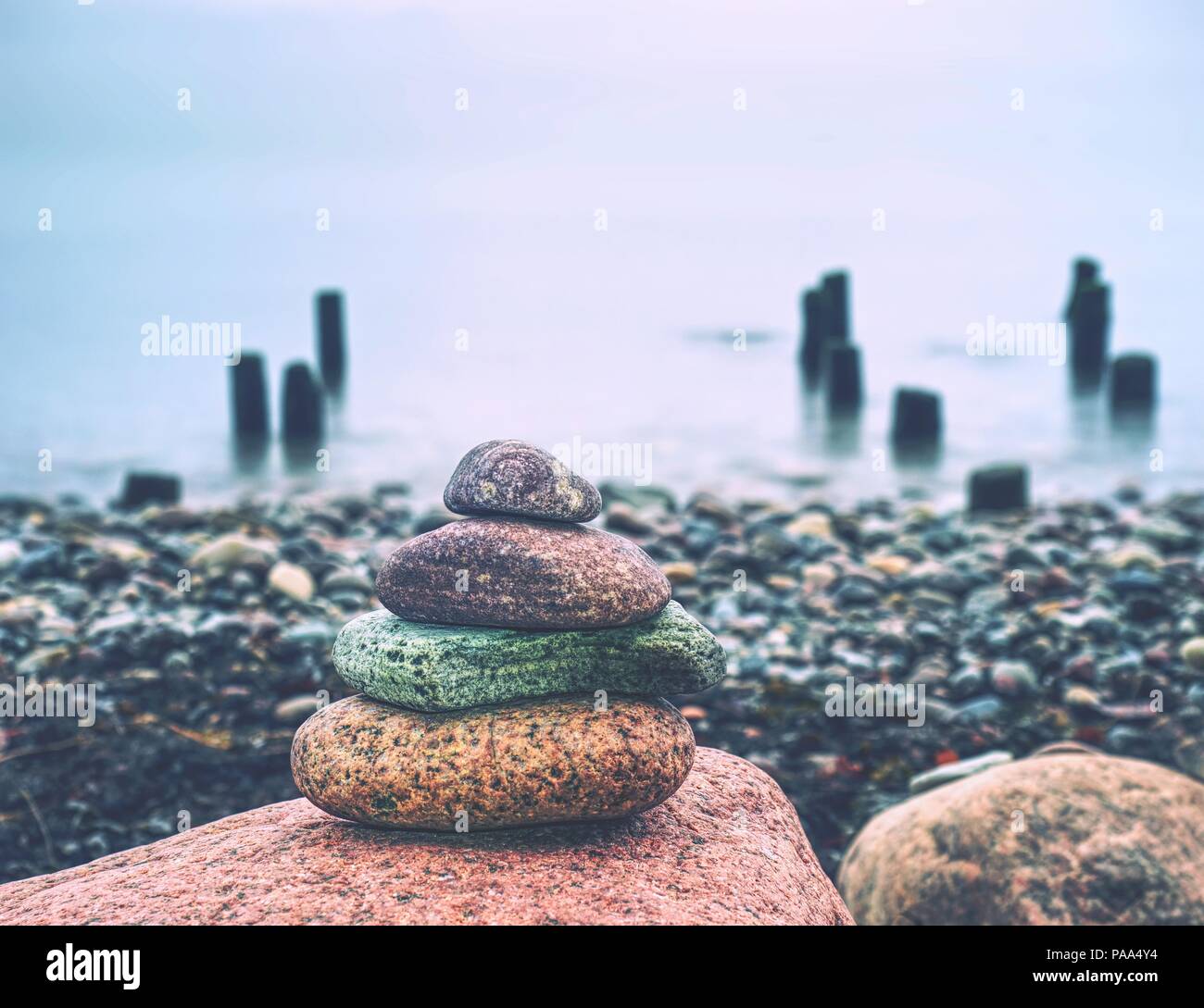 Stones pyramid symbolizing zen harmony balance pebbles. Peaceful ocean ...