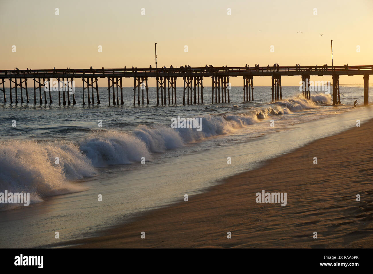 Sunset beach pier waves surf hi-res stock photography and images - Alamy