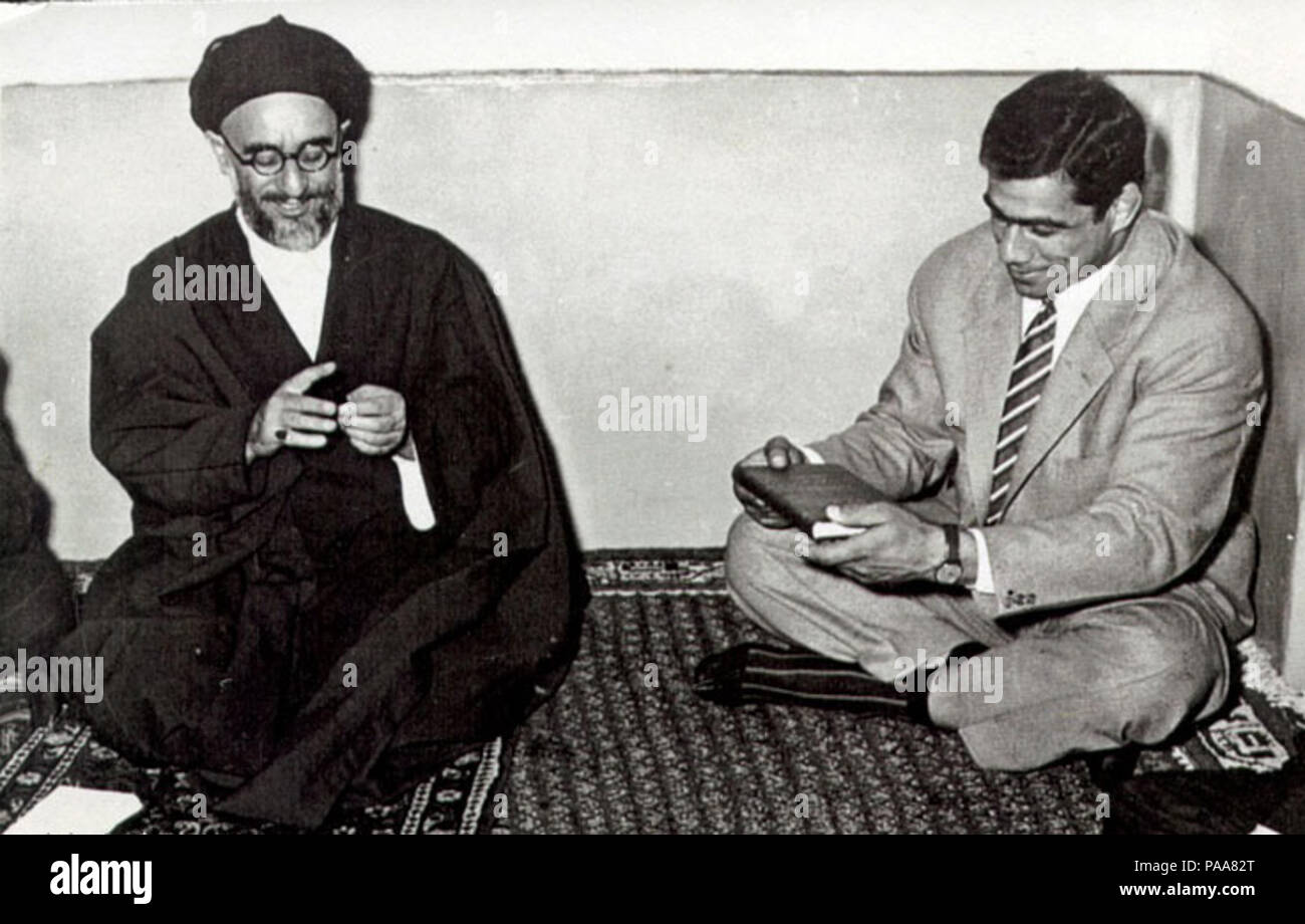 164 Mahmoud Taleghani gives a Quran as gift to Gholamreza Takhti in a ...
