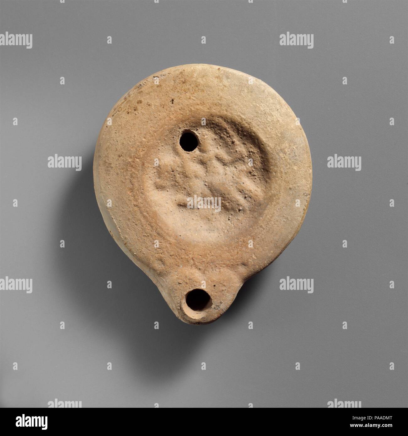 Lamp. Culture: Roman. Dimensions: Overall: 7/8 x 3 1/4 in. (2.2 x 8.3 ...