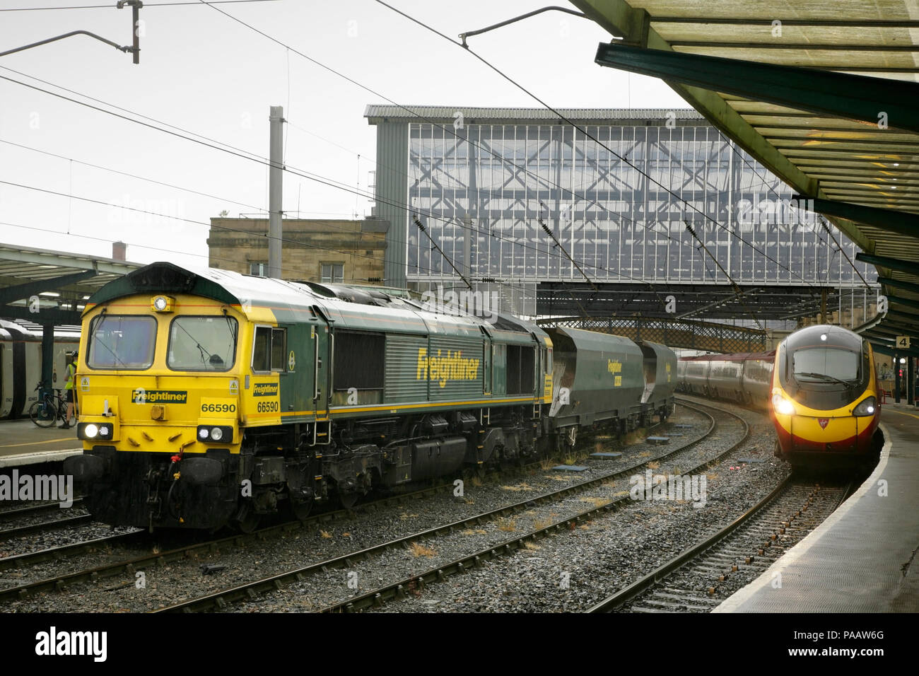 Freightliner class 66 diesel locomotive 66590 with freight train, and ...