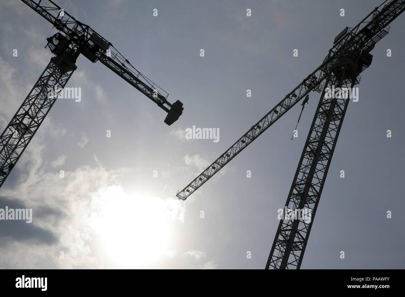 Two tower cranes Stock Photo - Alamy