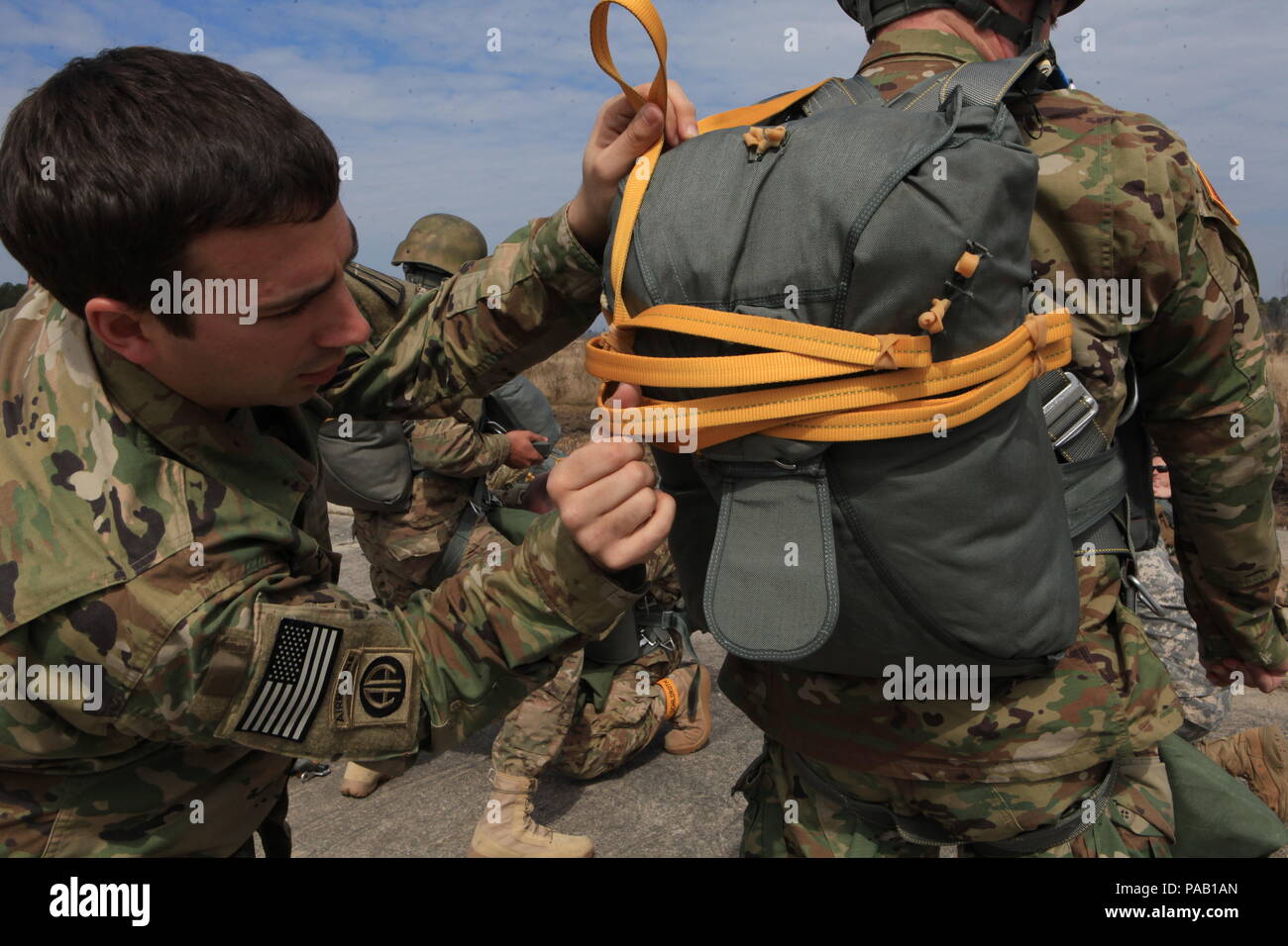 U.S. Army Staff Sgt. Fresco, a Communications Sergeant and jumpmaster ...