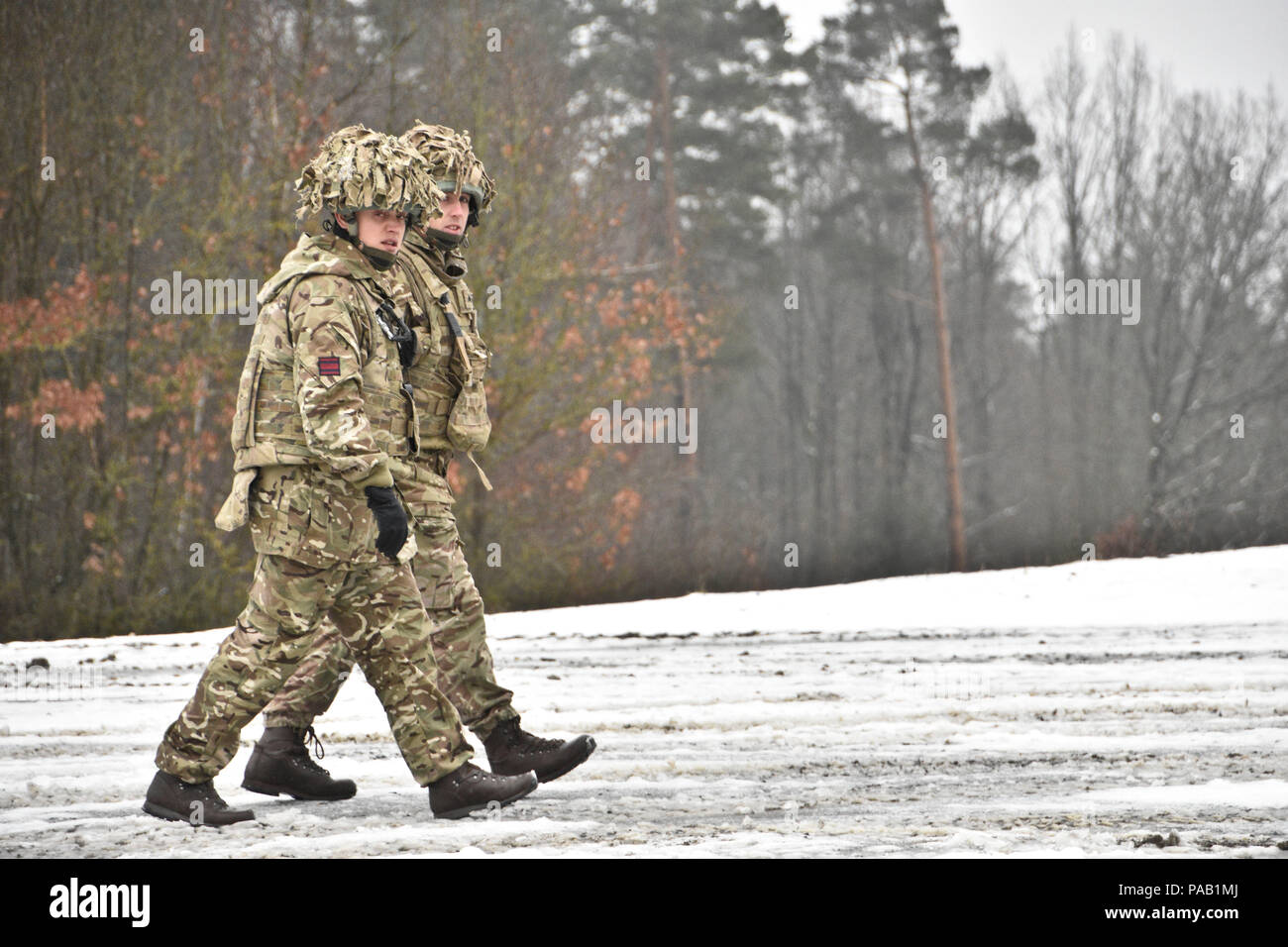 Soldiers from the 22nd Engineer Regiment, British Army, walk toward an ...