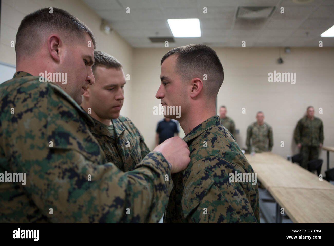 U.S. Marine Corps Sgt. Jonathon D. Manuel (right), a Combat Instructor ...