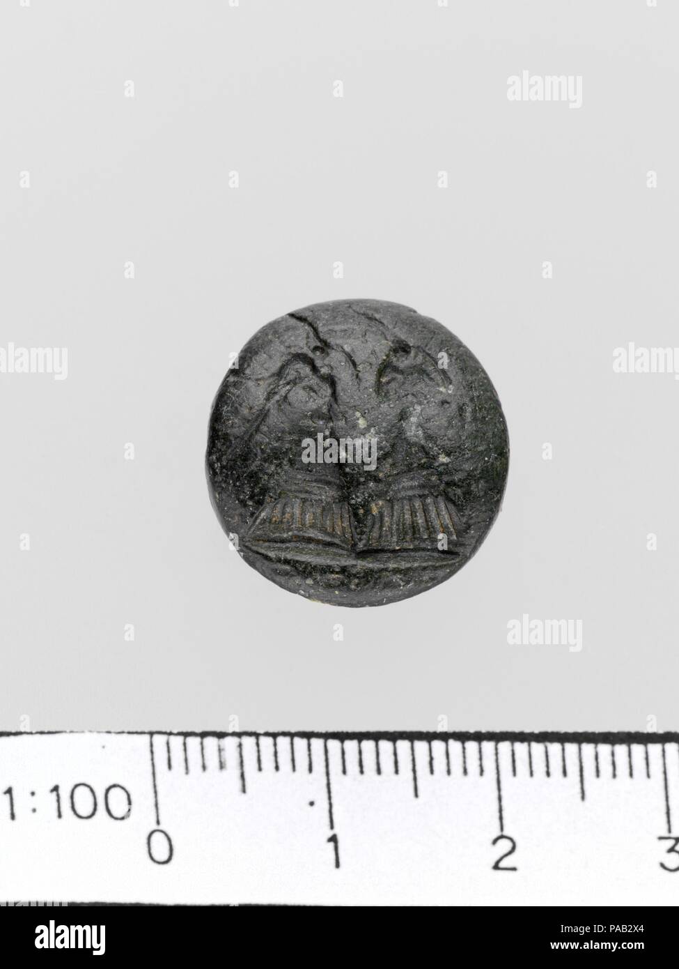 Steatite lentoid seal. Culture: Minoan. Dimensions: L. 1.8 cm; W. 1.65 ...
