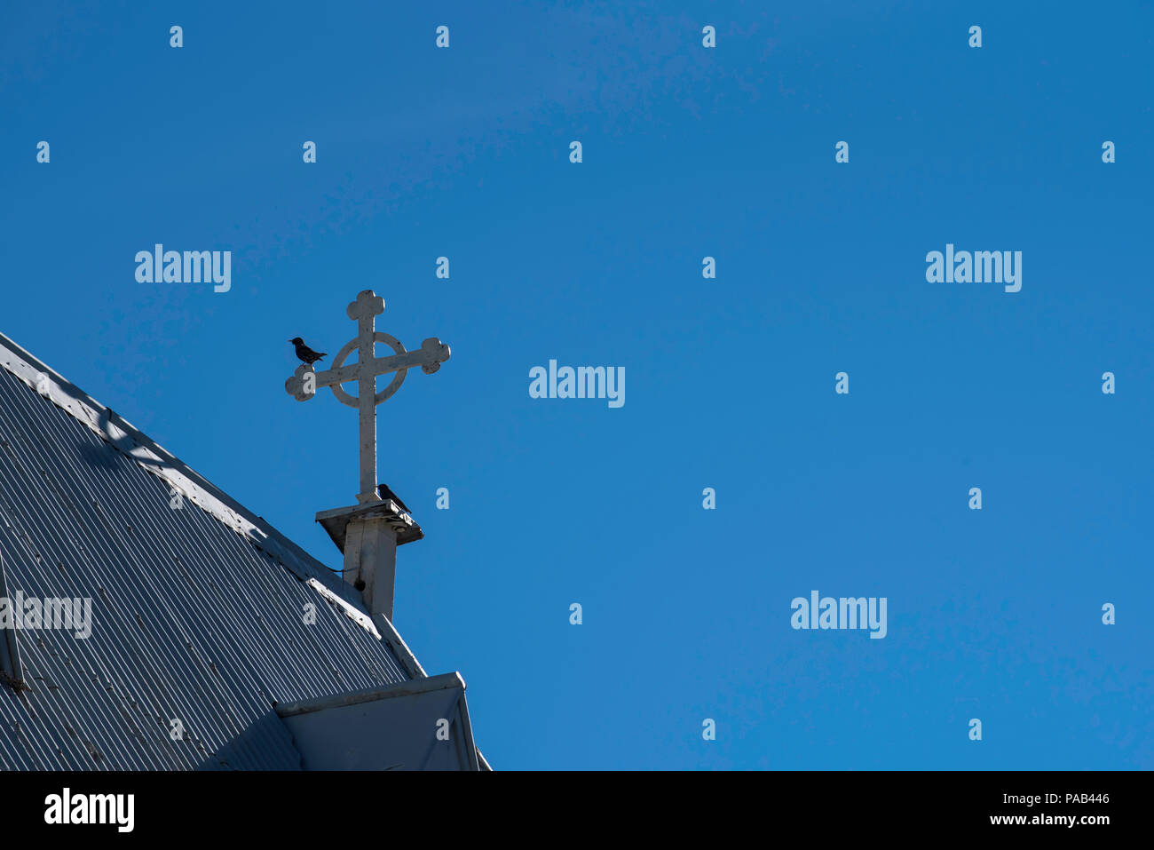 A Christian cross on a gable end of a tin roofed church in Bowral ...