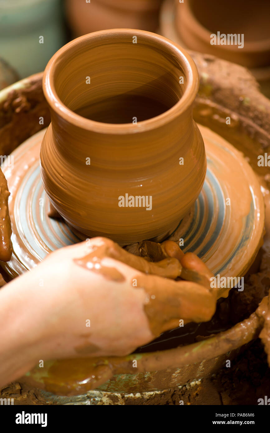 hands of a potter, creating an earthen jar Stock Photo - Alamy