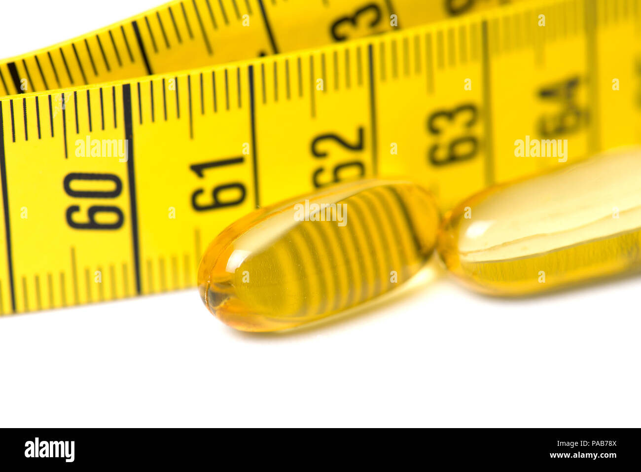 measuring tape with tablets Stock Photo - Alamy