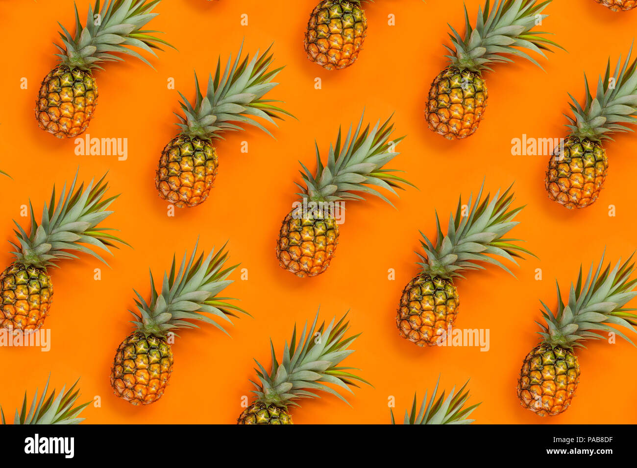 Fresh Pineapple In the orange background Stock Photo - Alamy