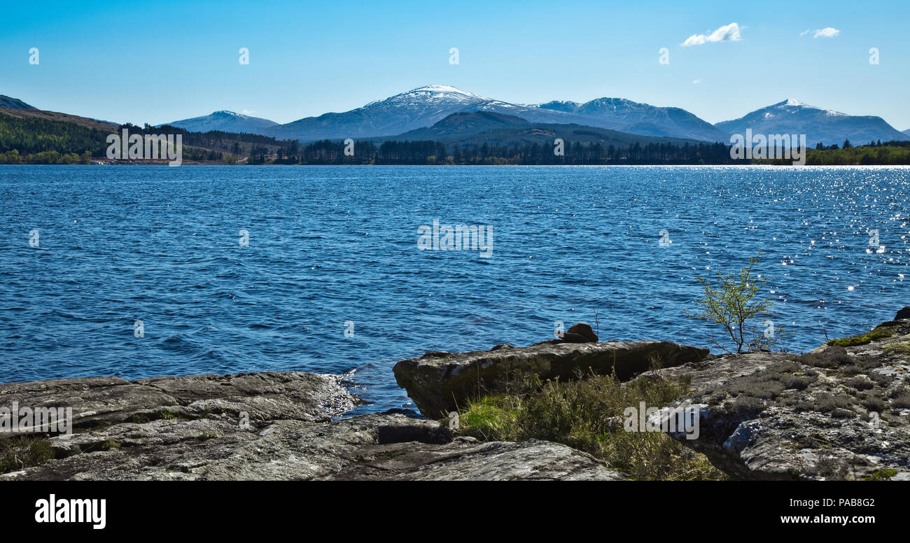 A photography of a typical scottish loch Stock Photo - Alamy