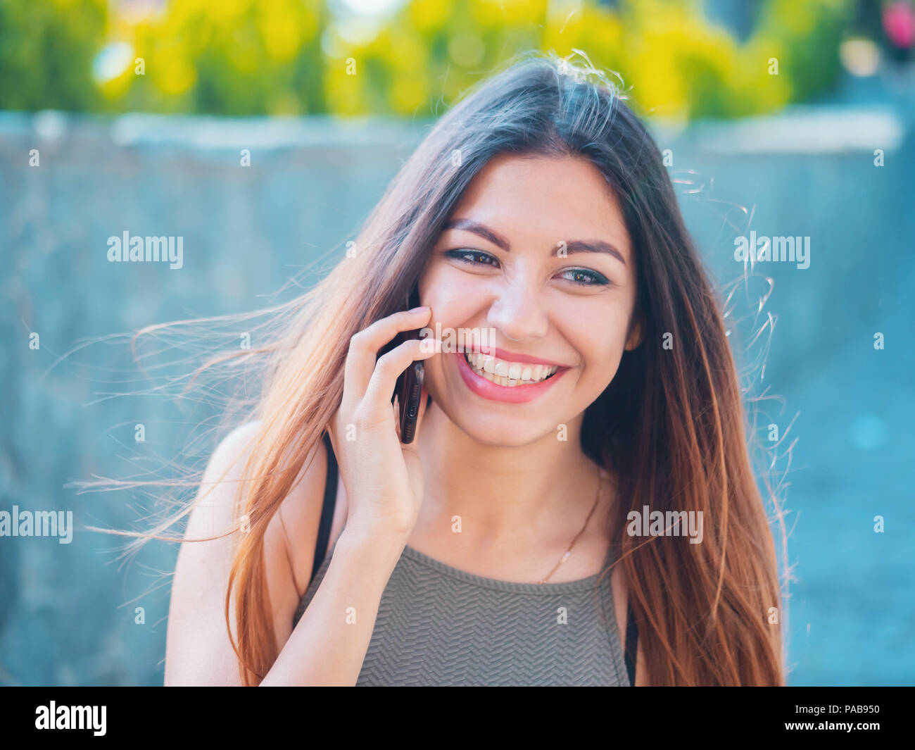 Female speaking on her cellphone. Technology, smartphone concept. Woman ...
