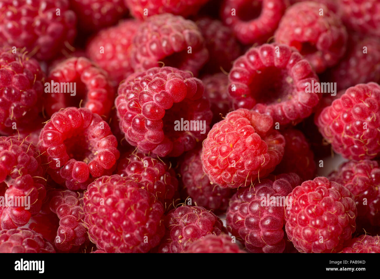 Raspberry fruit background Stock Photo - Alamy