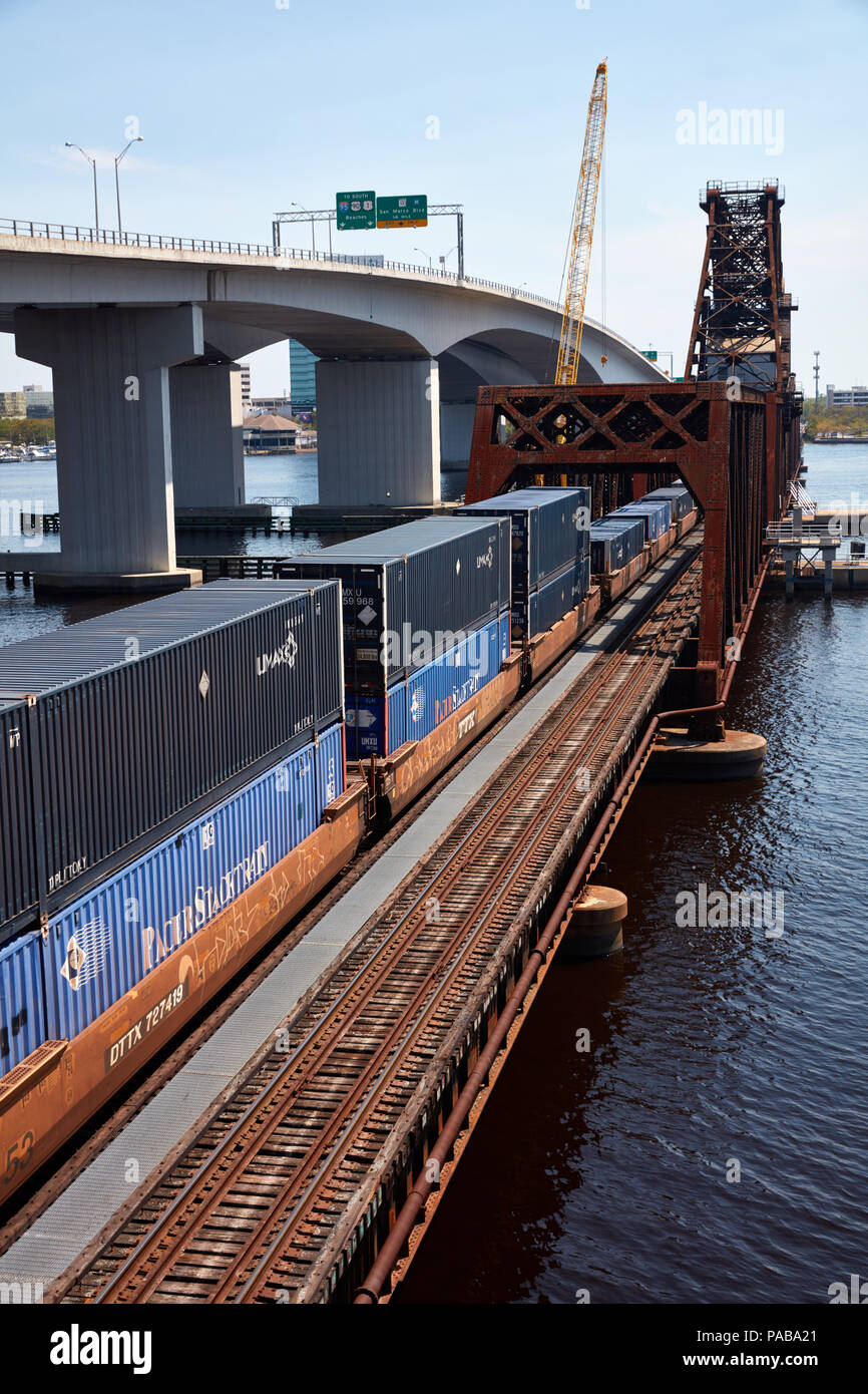 Train loaded with shipping containers crossing over the St. Johns River ...