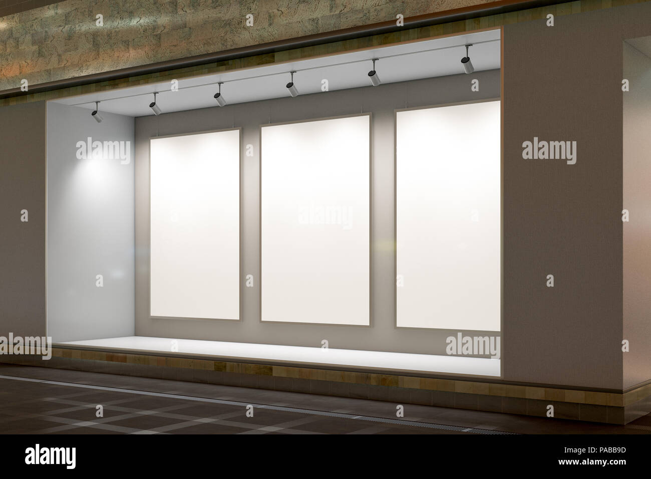 Empty store window at night. Thre blank posters in illuminated ...