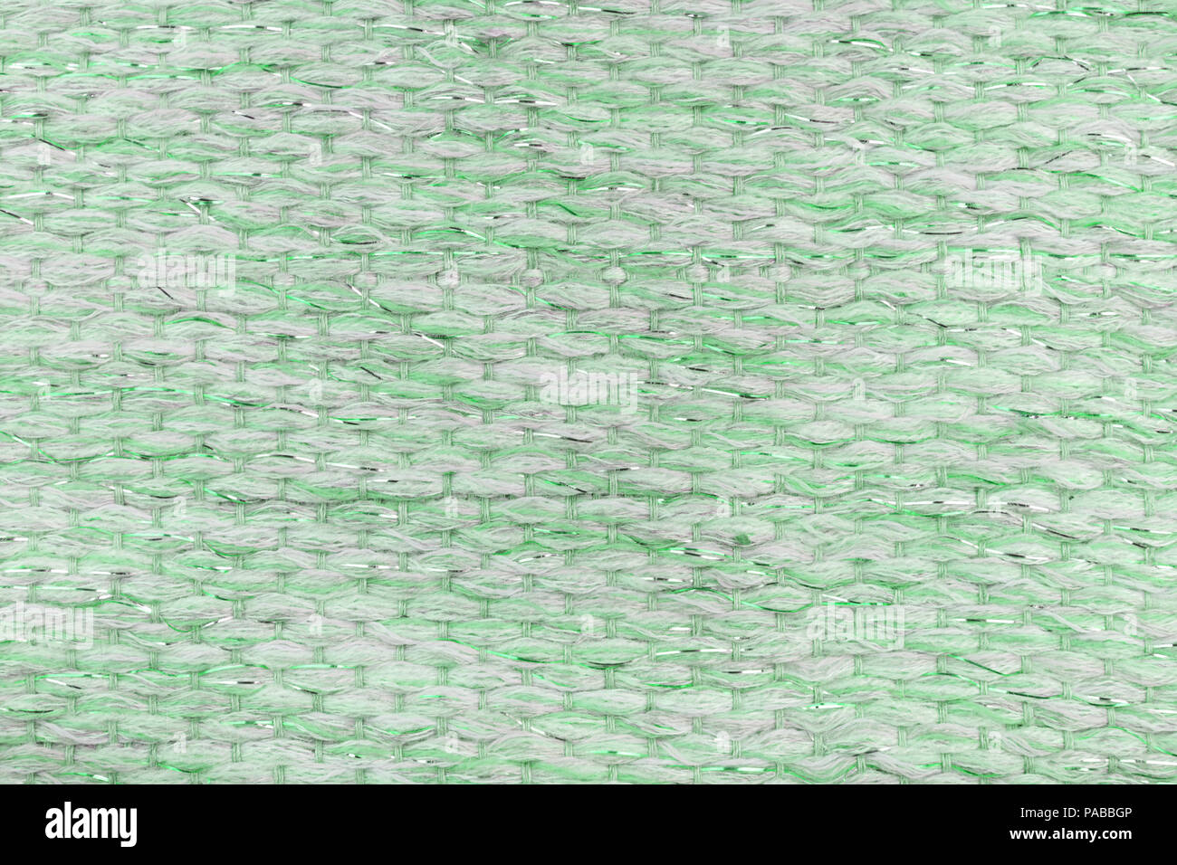 Green weaving matting tweed with lurex shiny fiber texture closeup ...