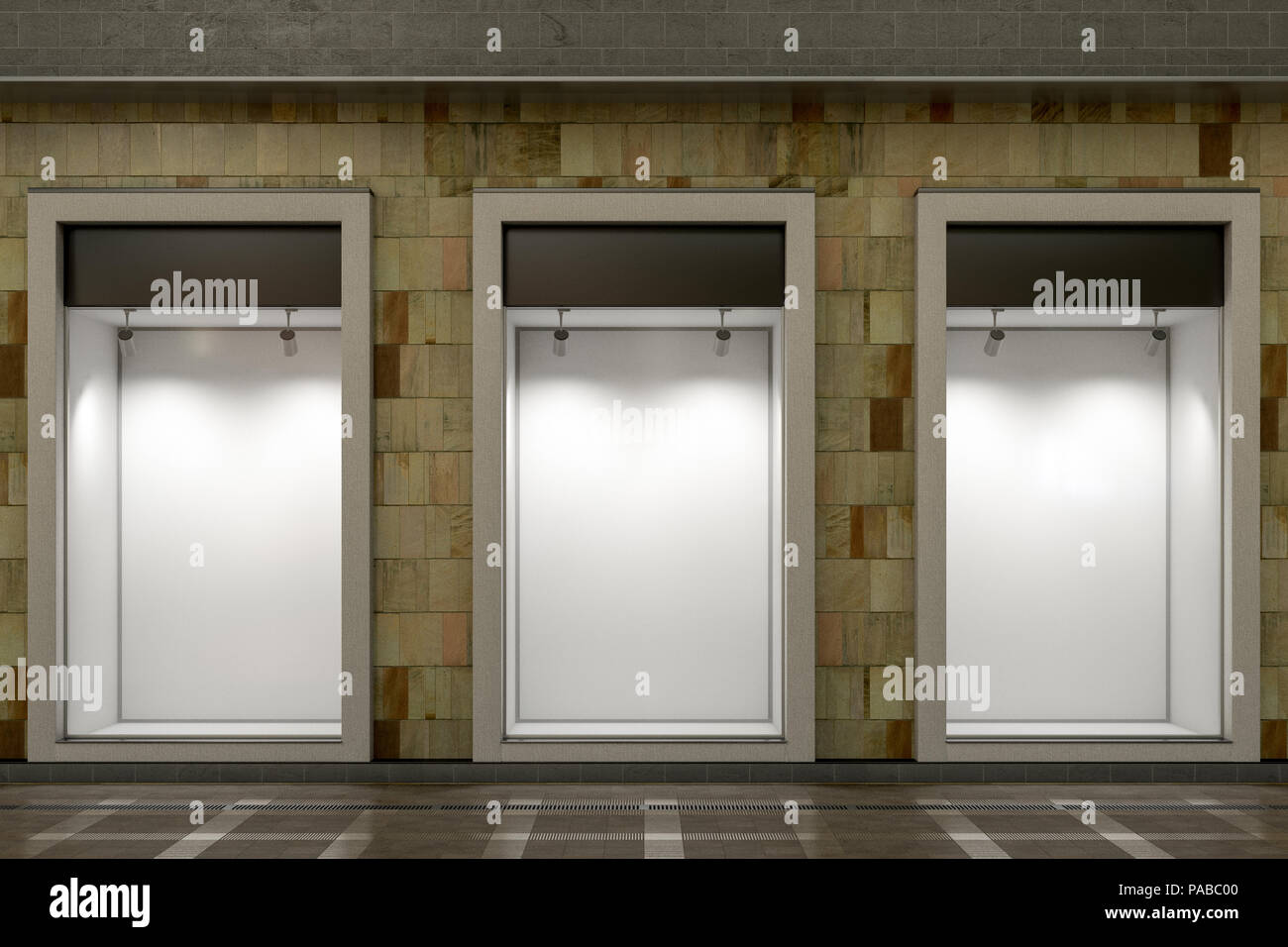 Empty store windows at night. Three blank illuminated storefront ...