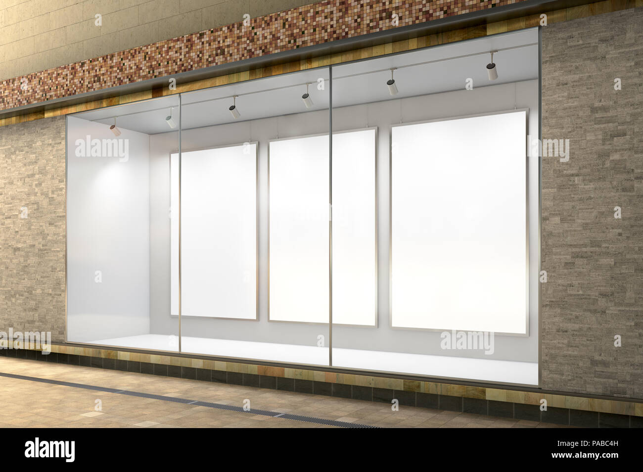 Empty store window. Three blank posters in illuminated storefront ...