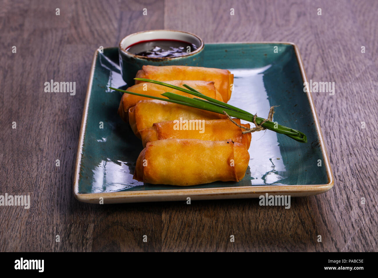 Spring roll with sauce served onion Stock Photo - Alamy