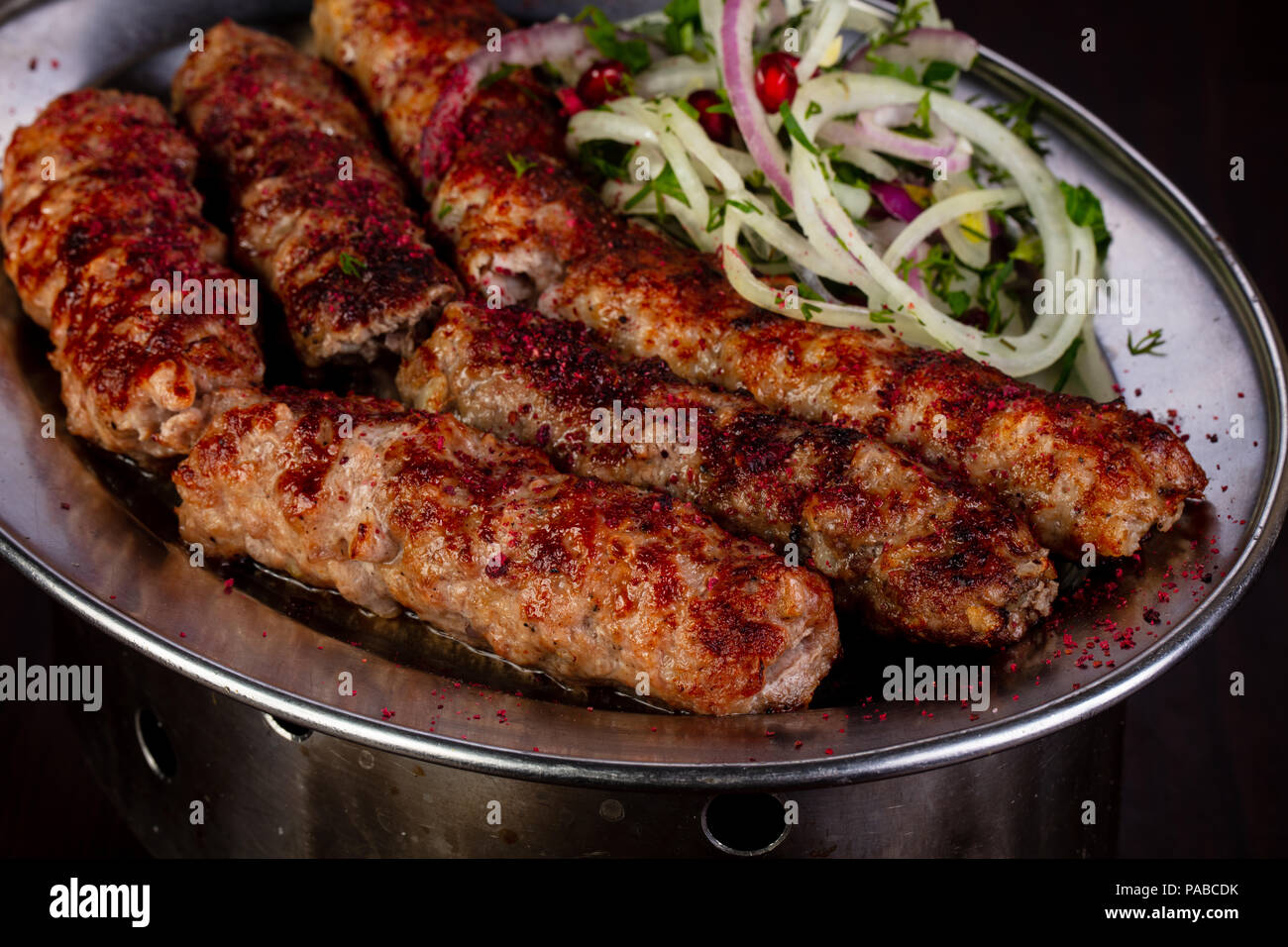 Grilled meat kebab with onion Stock Photo - Alamy