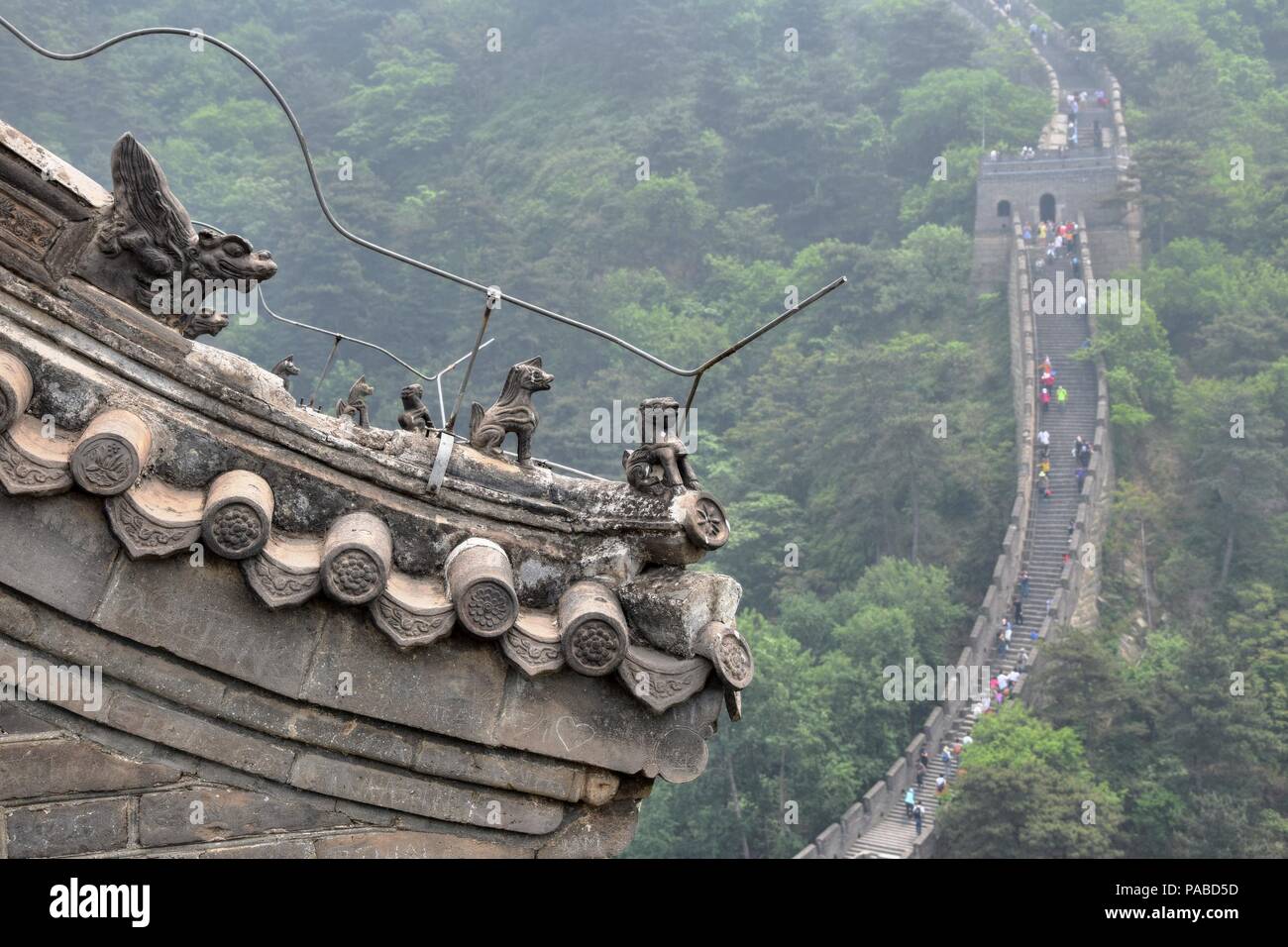 The detail of the ornamented ridge on the watchtower with the Chinese ...