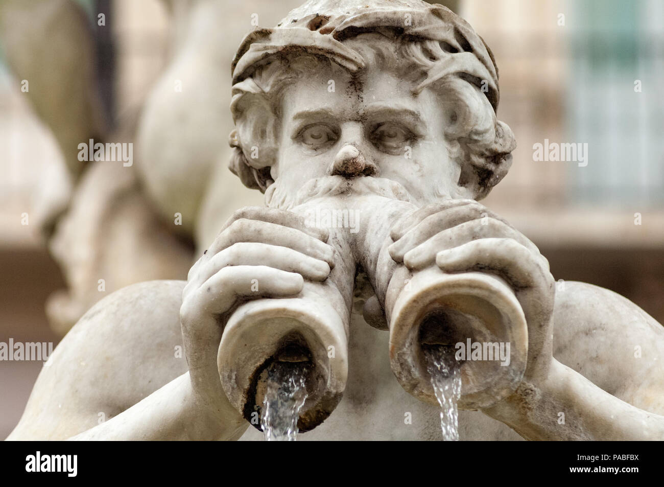 A Triton blows on a conch shell on the Fontana del Moro fountain in ...