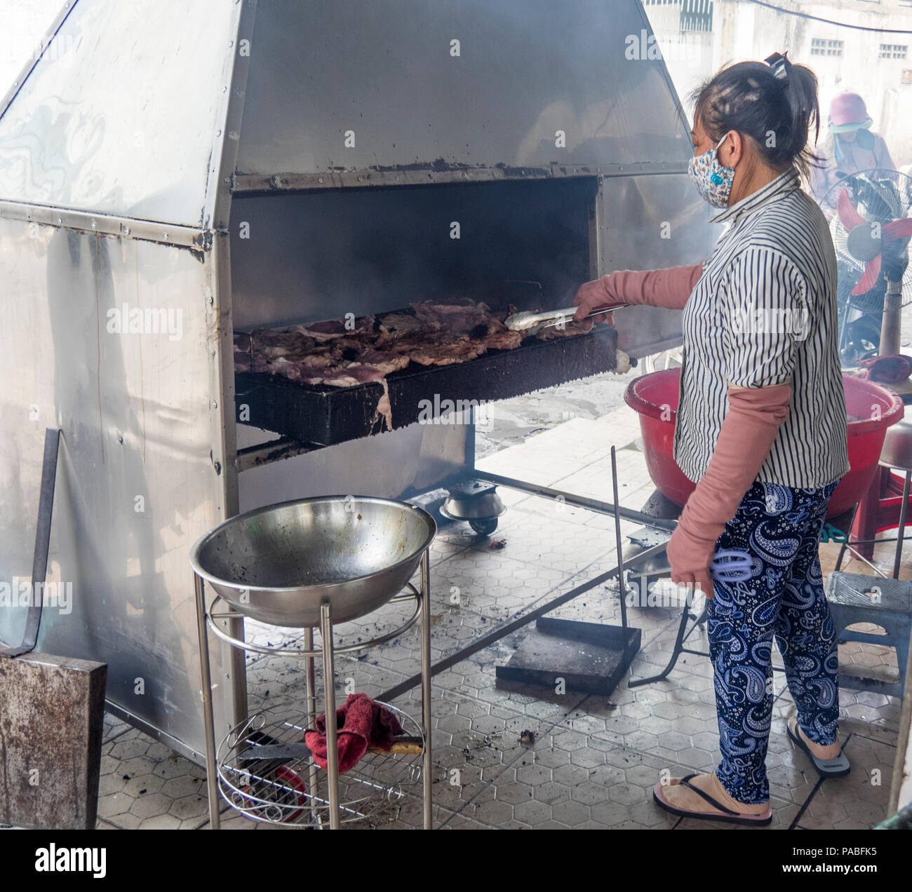 Asian female chef cooking hi-res stock photography and images - Alamy