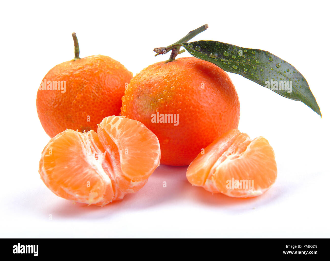 clementines with segments with leaves on a white background Stock Photo ...