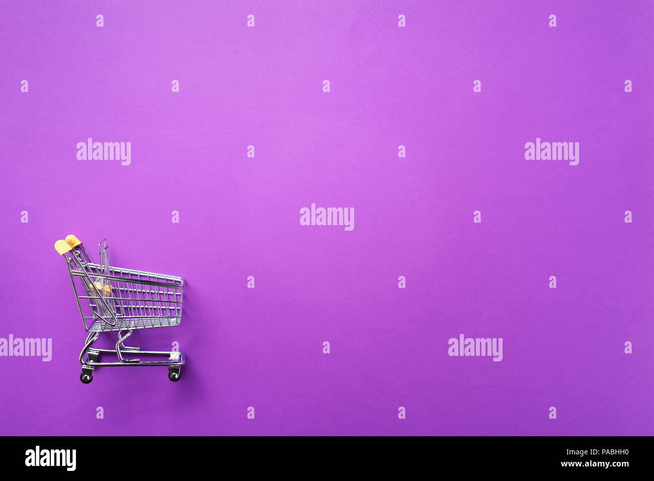 Shopping cart on violet background. Minimalism style. Creative design ...