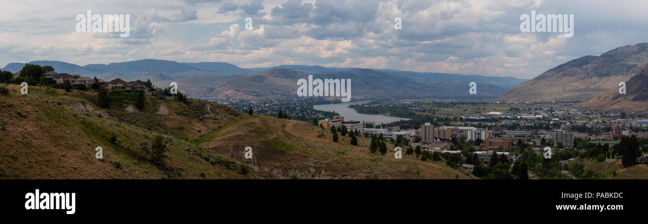 Aerial panoramic view of Kamloops City during a cloudy summer day ...